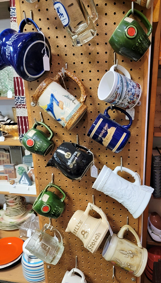 Coffee mugs with more personality than most people, hanging like caffeinated works of folk art.