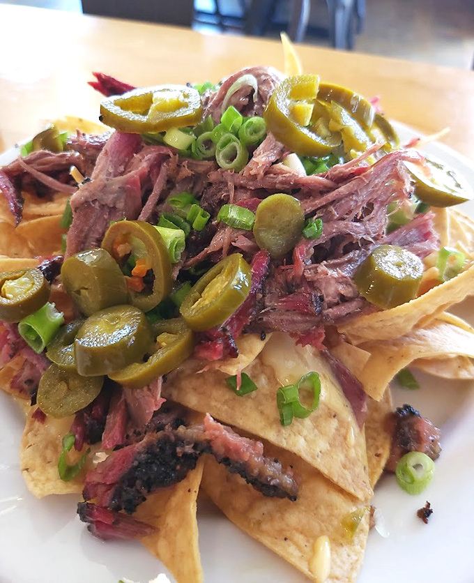 Barbecue nachos that don't mess around – where every chip is a treasure hunt for smoky meat, jalapeños, and that perfect cheese pull.