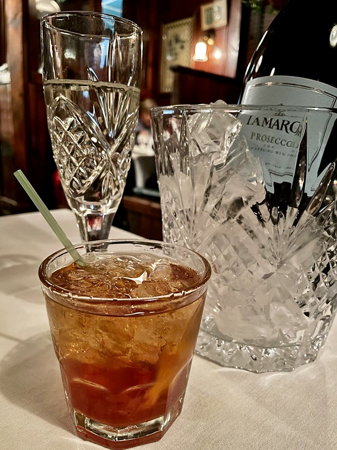 An Old Fashioned that respects tradition while loosening your tie. Crystal glassware elevates the experience from mere drinking to proper cocktail appreciation.
