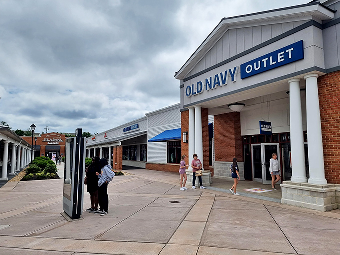 Old Navy's colonial-style storefront proves even budget-friendly fashion deserves elegant architectural housing. Democracy in retail form.