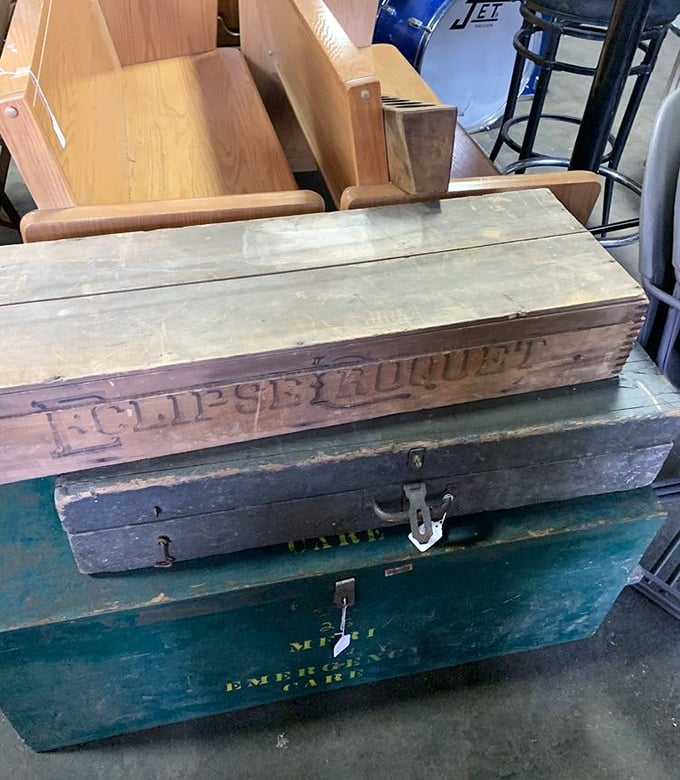 These wooden crates whisper stories of their previous lives. That "Eclipse Croquet" box probably witnessed some seriously competitive Victorian lawn games.