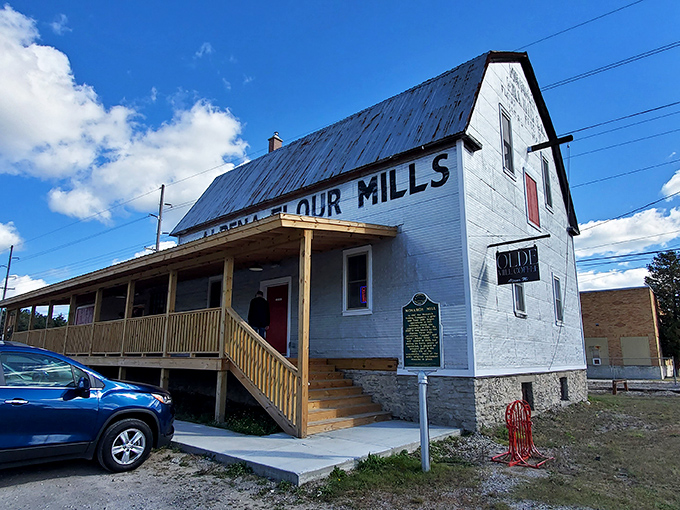 The historic Olde Flour Mills building has been reincarnated as a destination spot, its weathered sign a reminder of Alpena's industrial roots and resourceful spirit.