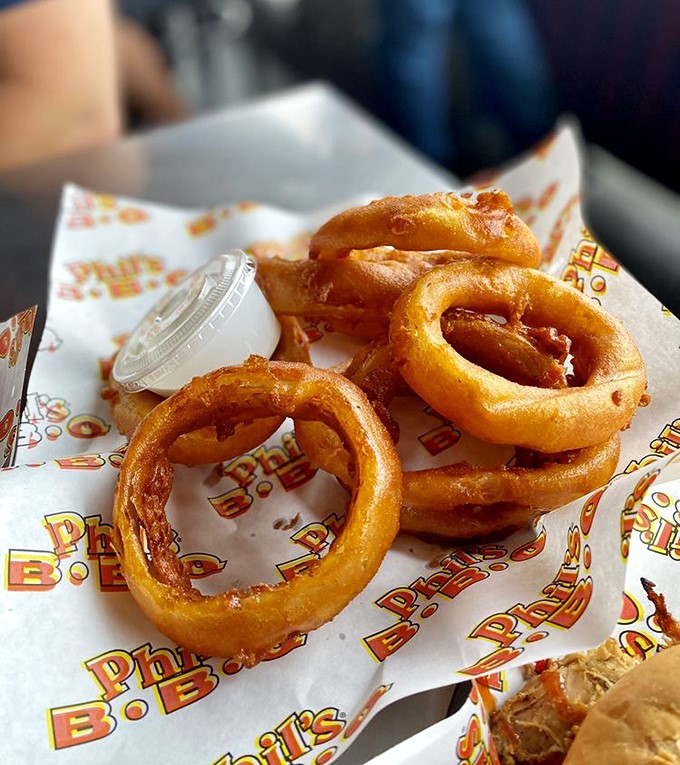 These aren't just onion rings—they're golden halos of crispy perfection that make you question why vegetables ever bothered growing underground.