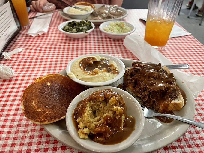 The open-face roast beef doesn't hide behind pretense&mdash;it proudly displays its gravy-soaked goodness alongside cornbread that's clearly not from a box.