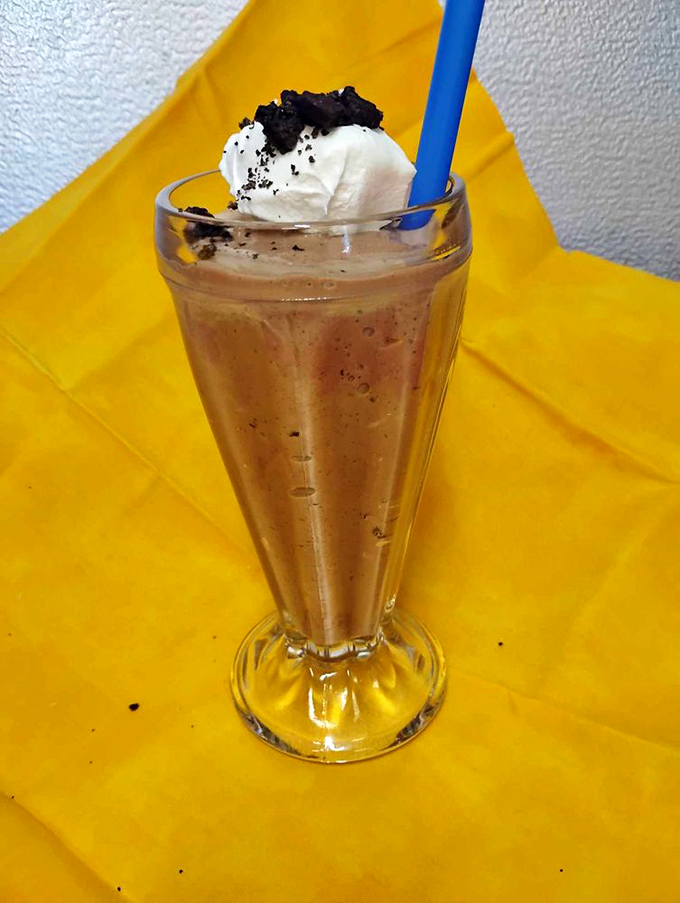 The s'mores milkshake&mdash;childhood campfire memories transformed into creamy, sippable nostalgia, complete with that perfect whipped cream crown.