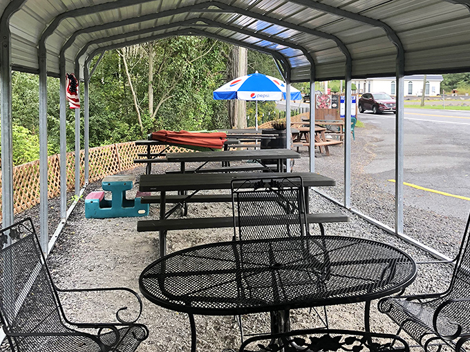 Picnic tables under metal awnings create the perfect summer dining room where memories are made between bites of perfection.