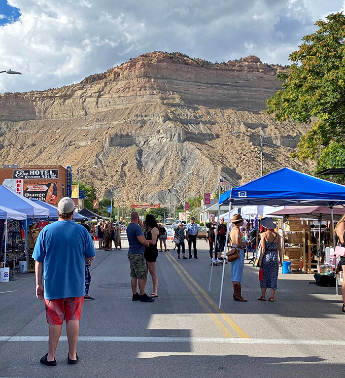 Helper's street market transforms Main Street into a vibrant community living room, with those magnificent cliffs serving as Mother Nature's wallpaper.