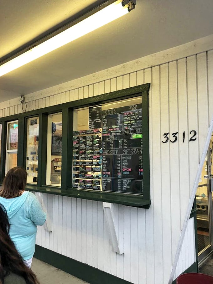 Menu gazing: Michigan's favorite summer sport. The outdoor service window at Clark's offers both visual temptation and the promise of cool satisfaction.