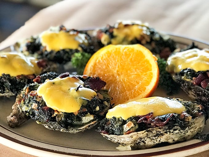 Oysters Rockefeller looking like they just got back from a spa treatment&mdash;pampered bivalves dressed in spinach, bacon and hollandaise that would make the richest Rockefeller jealous.