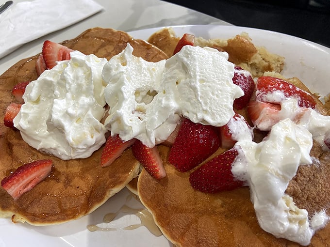 Strawberry pancakes with whipped cream that don't just say "good morning"&mdash;they practically sing it in four-part harmony.