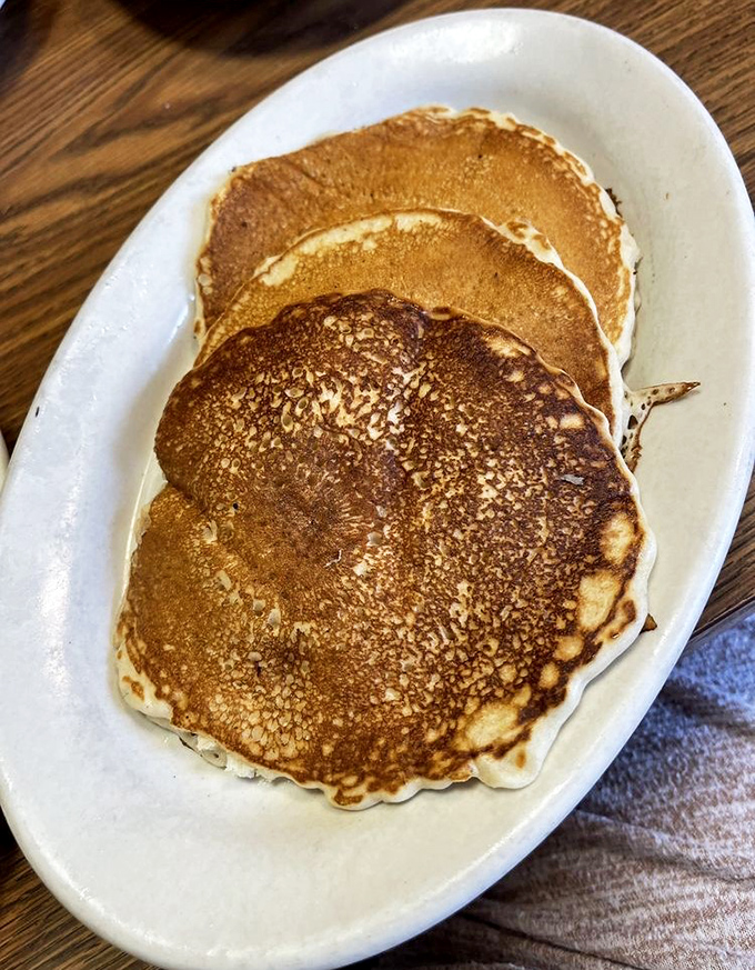 These pancakes aren't just round&mdash;they're perfectly bronzed discs of happiness that make you question why anyone would ever skip breakfast.