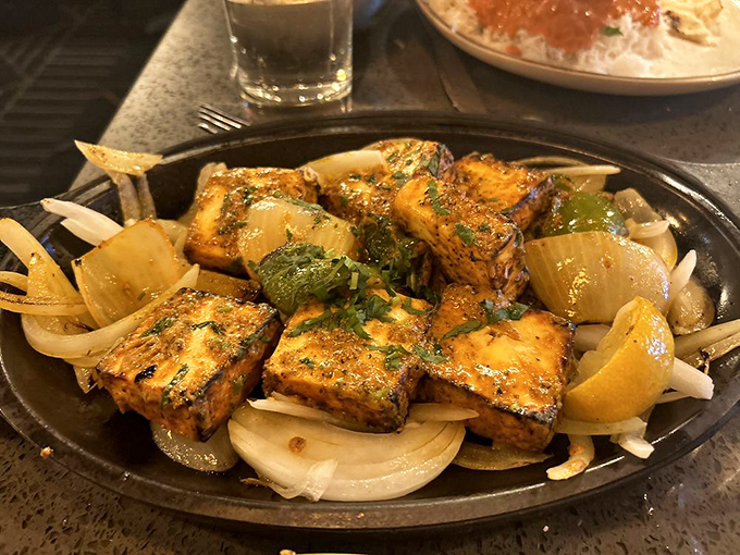 Paneer kebabs on parade, each cube grilled to perfection like tiny flavor ambassadors.