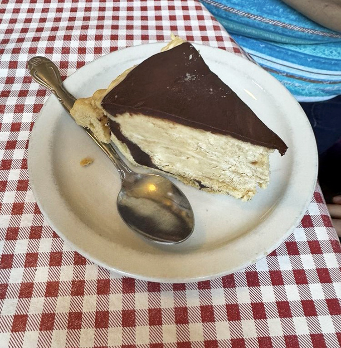 A slice of chocolate peanut butter pie that makes geometry finally make sense &ndash; the perfect triangular equation of sweet, rich, and "I shouldn't, but I will."