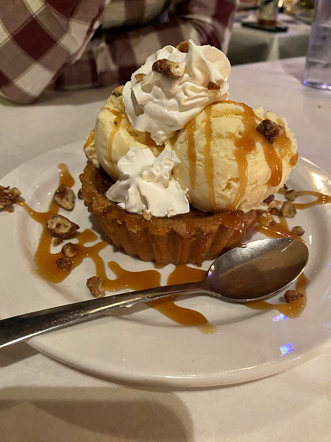 This isn't just dessert, it's a Southern hug on a plate. Pecan tart with ice cream, caramel, and whipped cream – because sometimes more is exactly right.