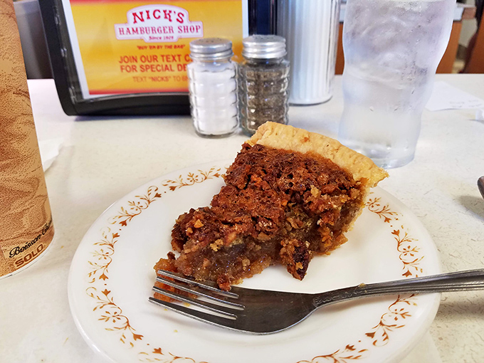 Pecan pie that looks like it should be under museum-quality glass. Each bite offers the perfect ratio of gooey filling to flaky crust.