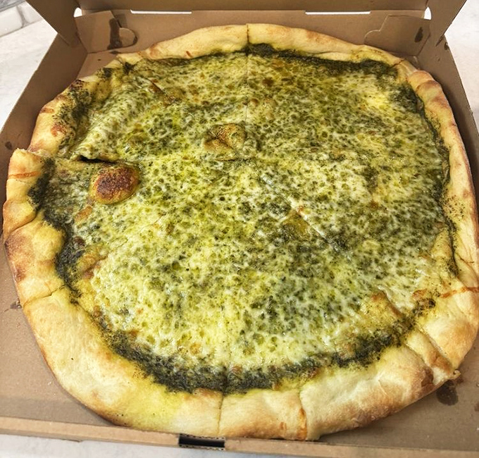 The pesto pizza&mdash;where basil goes to fulfill its destiny. That vibrant green canvas proves that not all masterpieces hang in museums.