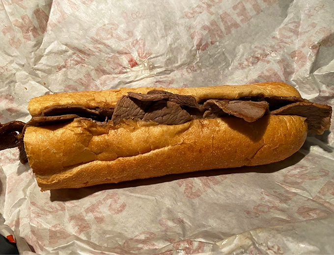 The wall of fame tells stories of celebrity visits, but the real stars are the sandwiches that brought them here in the first place.