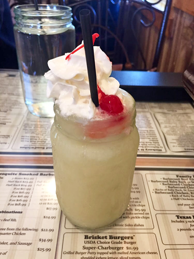 The pi&ntilde;a colada arrives like a tropical vacation in a mason jar &ndash; whipped cream mountain included. Suddenly, you're on island time.