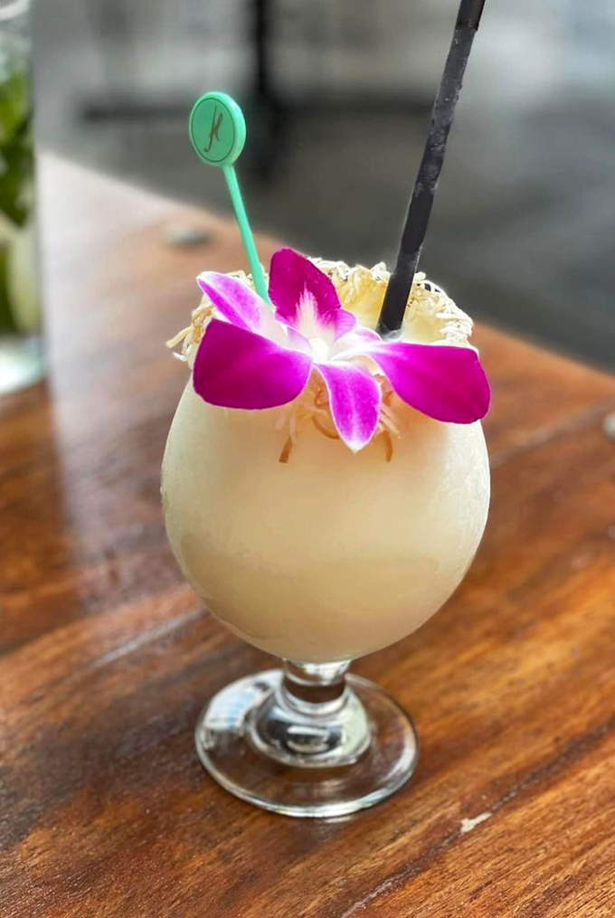 That orchid garnish and creamy tropical drink scream vacation vibes, even if you're just twenty minutes from your house.