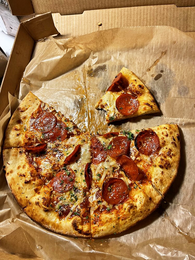 Pizza that proves even the classics deserve a starring role. The perfectly charred pepperoni cups holding little pools of flavor are the unsung heroes of this pie.