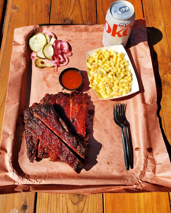 Those ribs look like they're ready for their close-up. The glistening bark and perfect pink interior are what BBQ dreams are made of.