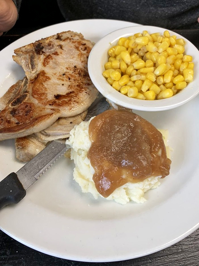 A pork chop that didn't come from a food stylist's dream but from a kitchen that understands the difference between eating and dining.