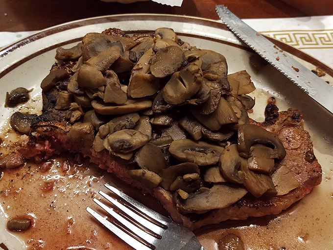 A porterhouse topped with saut&eacute;ed mushrooms demonstrates why Hickory's reputation extends beyond barbecue into serious steak territory.