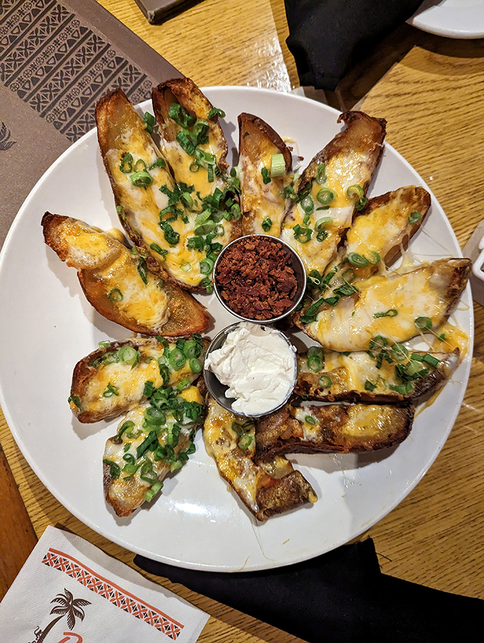 Potato skins arranged like a sunburst of cheesy, bacon-topped goodness. The sour cream center is the cool moon to this crispy solar system.
