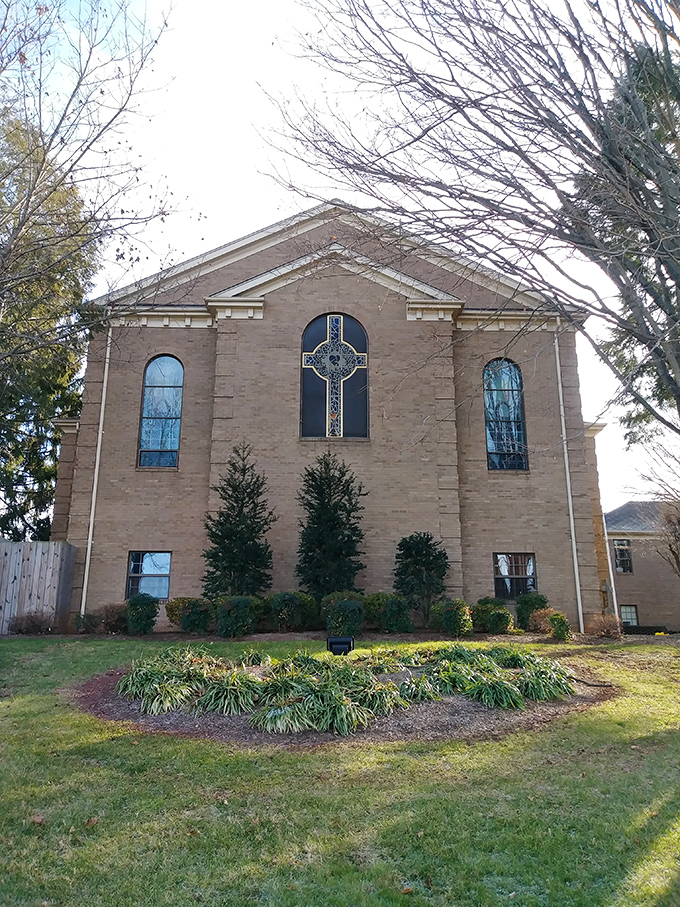 Precious Blood Catholic Church's stained glass catches the light like jewels &ndash; architectural proof that faith and beauty often share the same address.