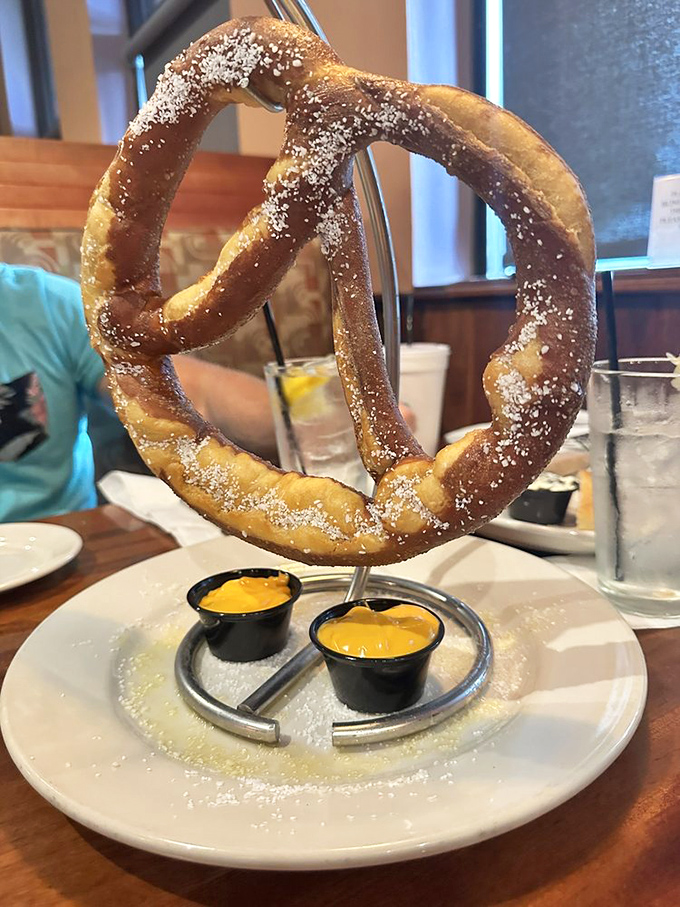 This isn't just any pretzel&mdash;it's a monument to carbohydrates, dramatically presented with dipping sauces that dare you not to finish every last bite.
