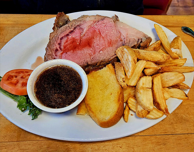 Prime rib so perfectly pink it deserves its own color swatch at Benjamin Moore. Those fries look like they've been practicing their crunch for years.