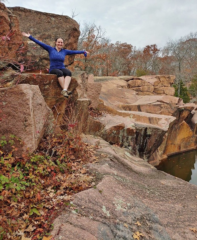 Victory perch! After conquering these ancient boulders, the triumphant pose comes naturally &ndash; geological achievement unlocked!