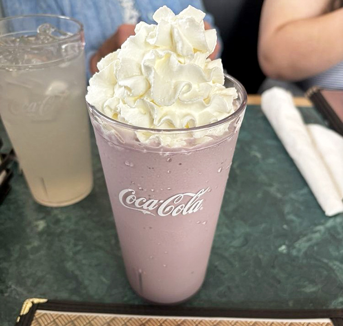 That raspberry milkshake topped with a cloud of whipped cream isn't just a drink; it's what childhood dreams are made of.