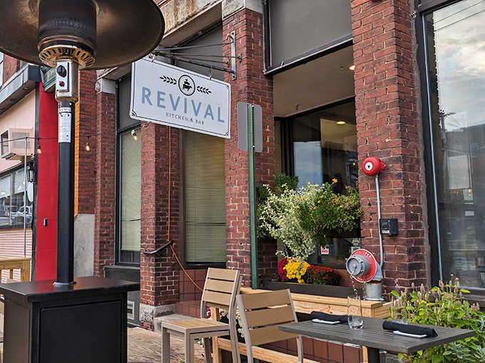 Revival Kitchen & Bar's outdoor seating captures that magical sweet spot between casual comfort and "I'm treating myself" without Manhattan prices.