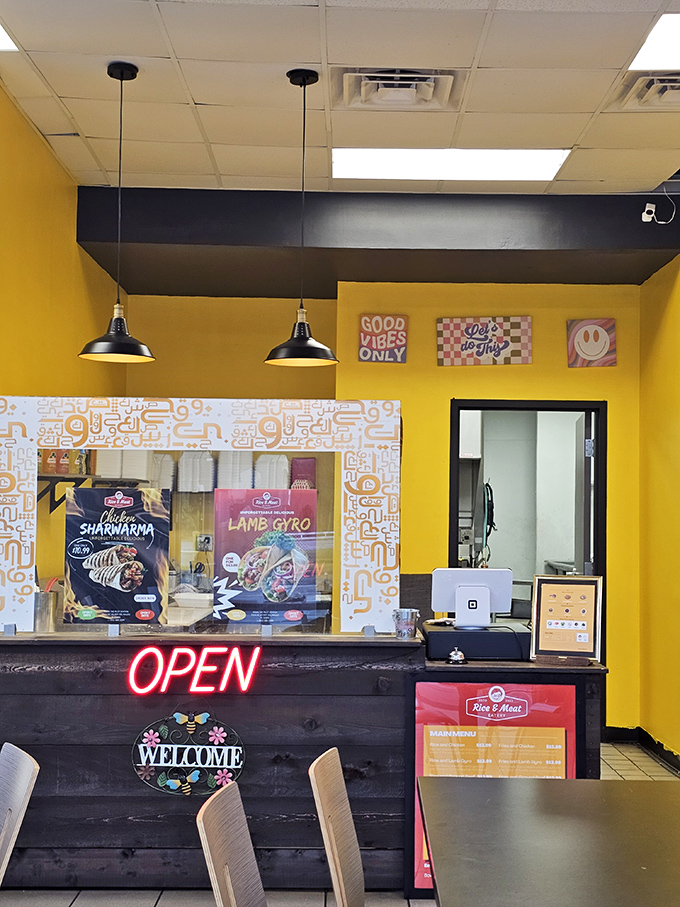 Bright yellow walls and "Good Vibes Only" signs set the tone at Rice & Meat, where Mediterranean flavors bring unexpected culinary diversity to small-town Florida.