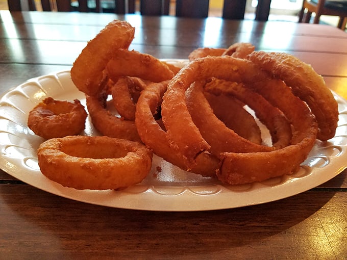 Onion rings with the structural integrity of Olympic gold &ndash; crispy armor protecting sweet, tender onion within.