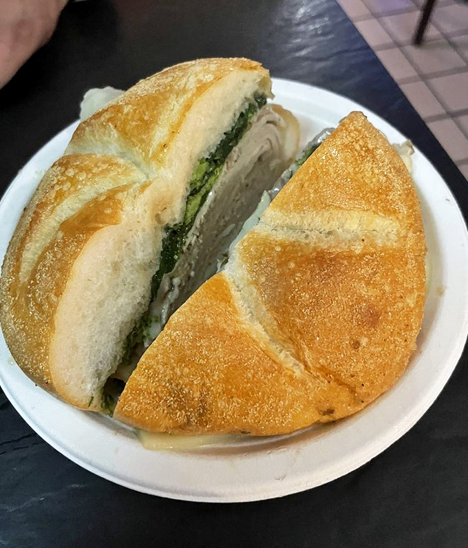When greens meet greatness. The bitter broccoli rabe creates a perfect counterpoint to the rich meat&mdash;a sandwich that understands balance.