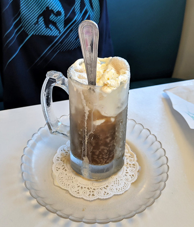 Root beer float served in a frosty mug with a proper spoon&mdash;proof that some pleasures never need upgrading.