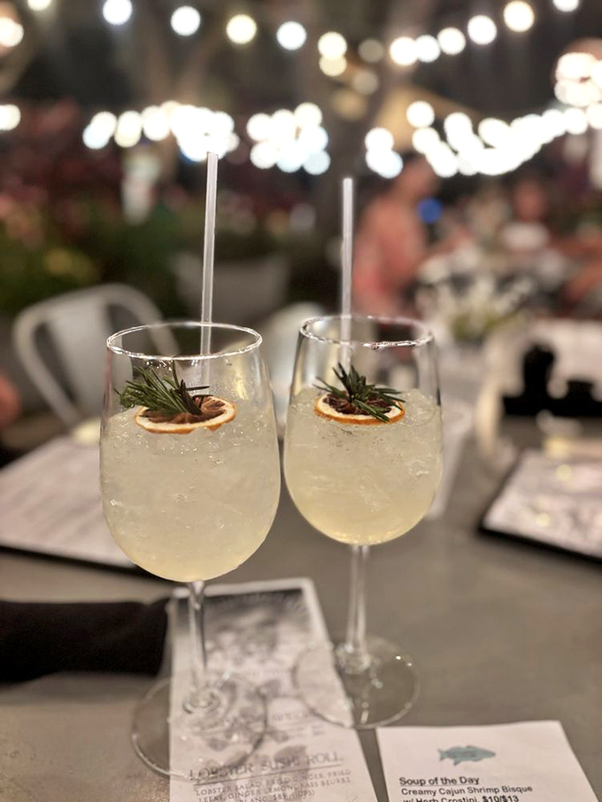 Two glasses of sunshine served with rosemary and citrus. The kind of refreshment that makes you extend your pinky finger without even realizing it.