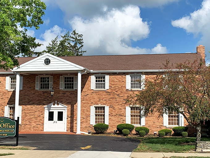 This well-maintained brick office building exemplifies Greenville's blend of traditional architecture and practical functionality – no coastal premium required.
