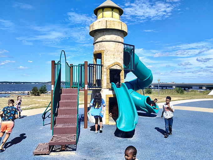 Sailwinds Park's lighthouse-themed playground delights children with waterfront views that would cost millions elsewhere but come standard in Cambridge.