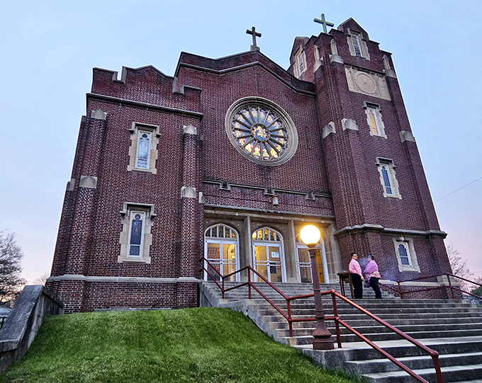 St. Mary's Catholic Church stands majestically at dusk, its rose window glowing like a spiritual nightlight for the city.