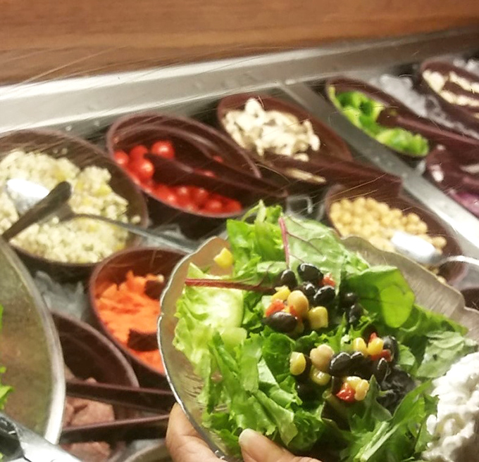 The salad bar's colorful bounty offers a fresh prelude to seafood indulgence &ndash; a rainbow of vegetables standing at attention.