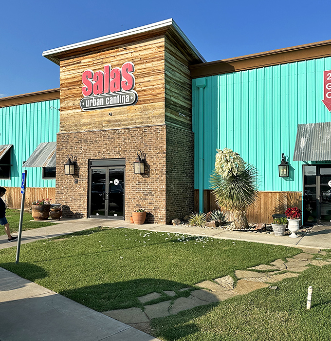 Salas Urban Cantina's vibrant turquoise exterior promises Mexican flavors that dance on your palate without trampling your monthly budget.