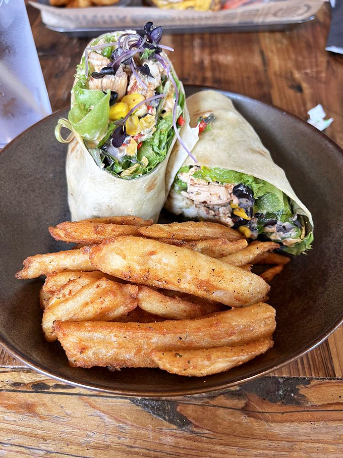 A wrap so fresh and colorful it almost feels virtuous. Almost. The crispy fries alongside remind you this is still a proper indulgence.