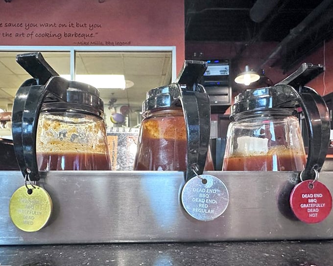 House-made sauces lined up like flavor soldiers, ready to enhance already perfect smoked meats.