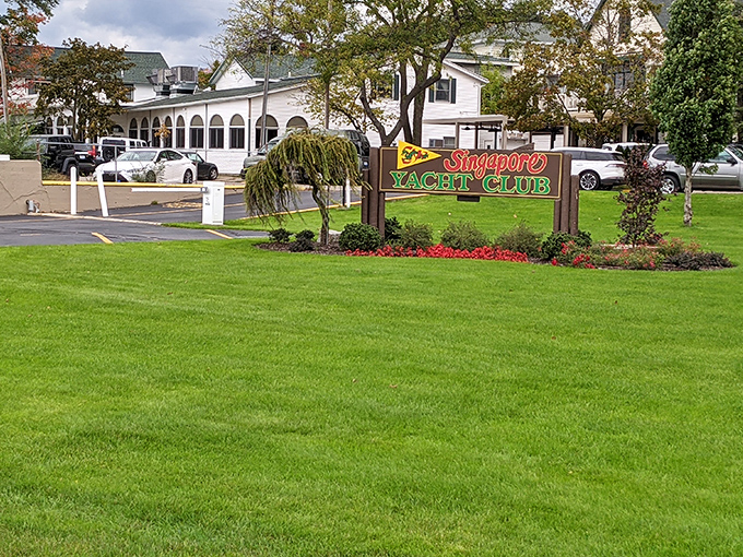 The Singapore Yacht Club sign stands as a reminder that in Saugatuck, even landlubbers can pretend they know port from starboard for a weekend.