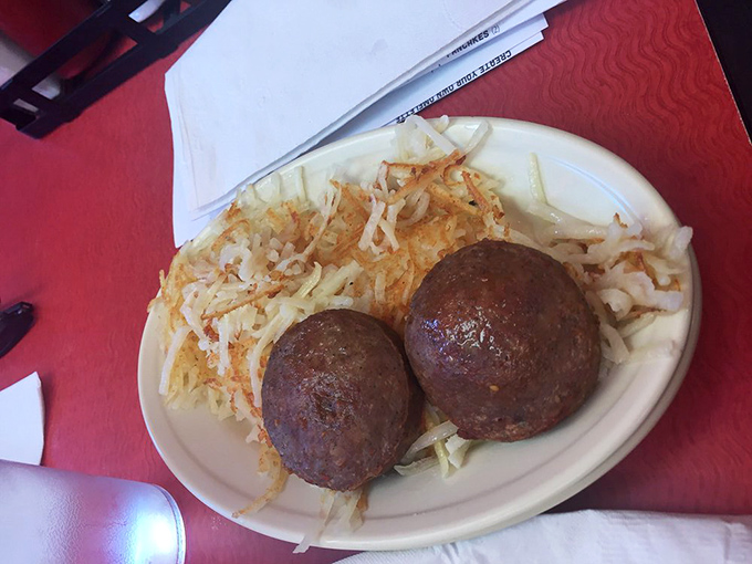 Two perfect breakfast ambassadors&mdash;sausage patties with golden hash browns. Simple, unpretentious, and exactly what you want at 8 AM.