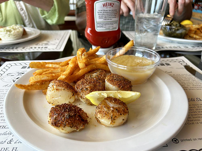 Perfectly seared scallops with golden fries &ndash; ocean candy that makes you wonder why people bother with regular candy.