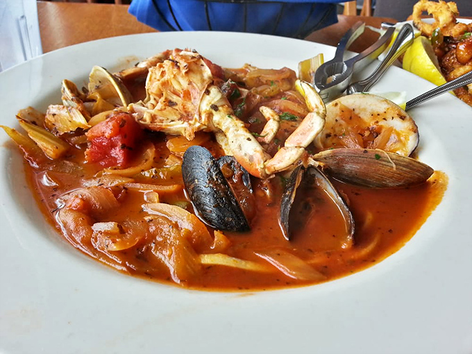 Cioppino: San Francisco's legendary seafood stew where shellfish swim in tomato broth like they're training for the Olympics.